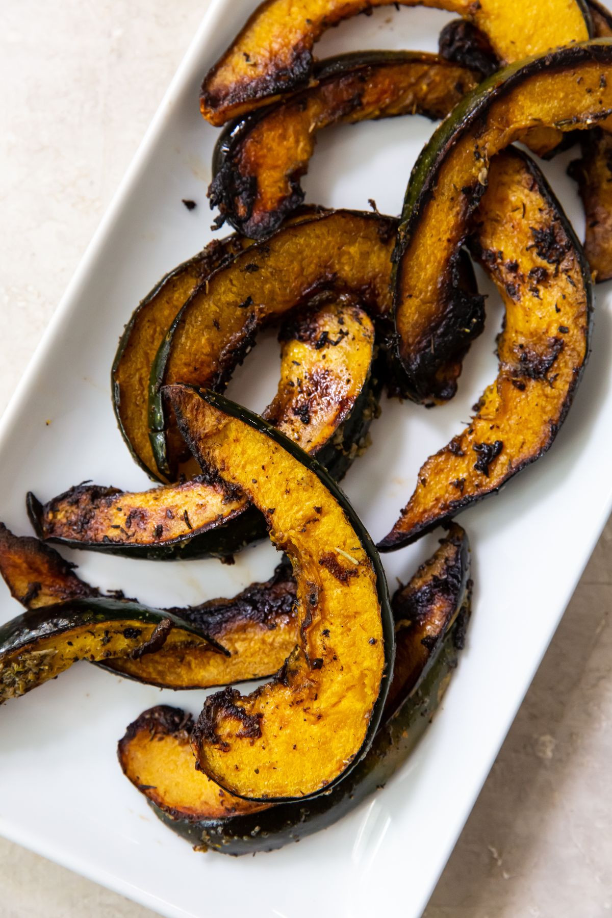 Grilled Blackstone Acorn Squash - Lara Clevenger